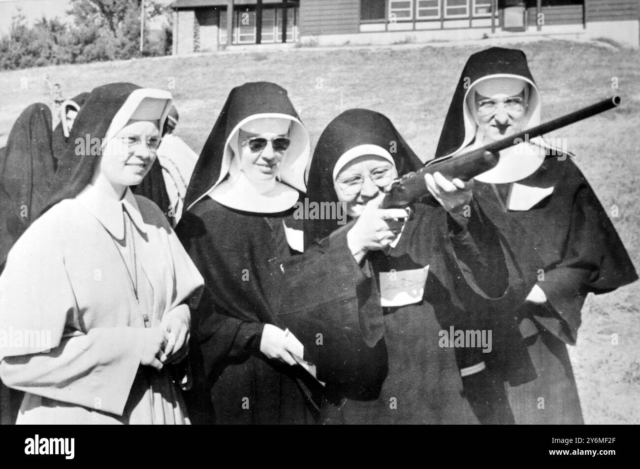 Cincinnati, Ohio: A group of nuns trying their hand a target practice ...