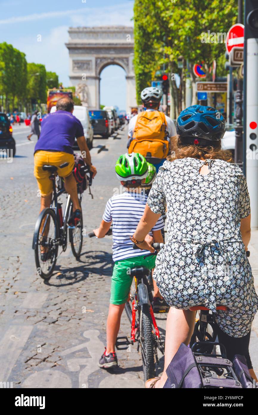 France, Paris, Bike path in the city center. Cyclists on a cycle path ...