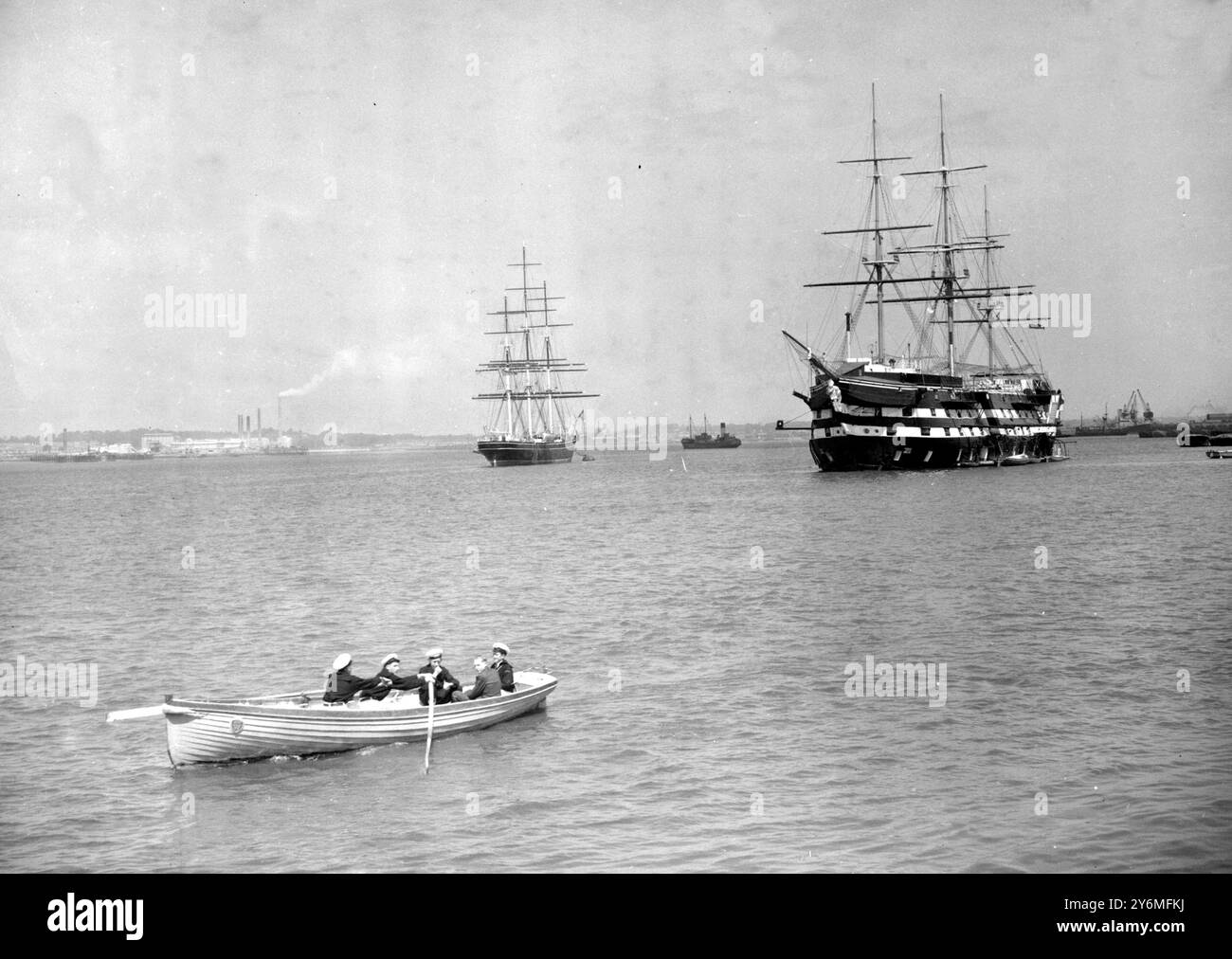 Cutty Sark's arrival as it moors alongside HMS Worcester on the River ...