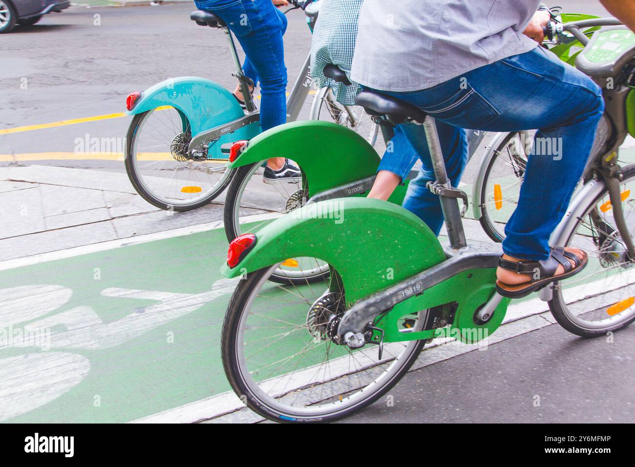 France, Paris, Bike path in the city center. Cyclists on a cycle path ...