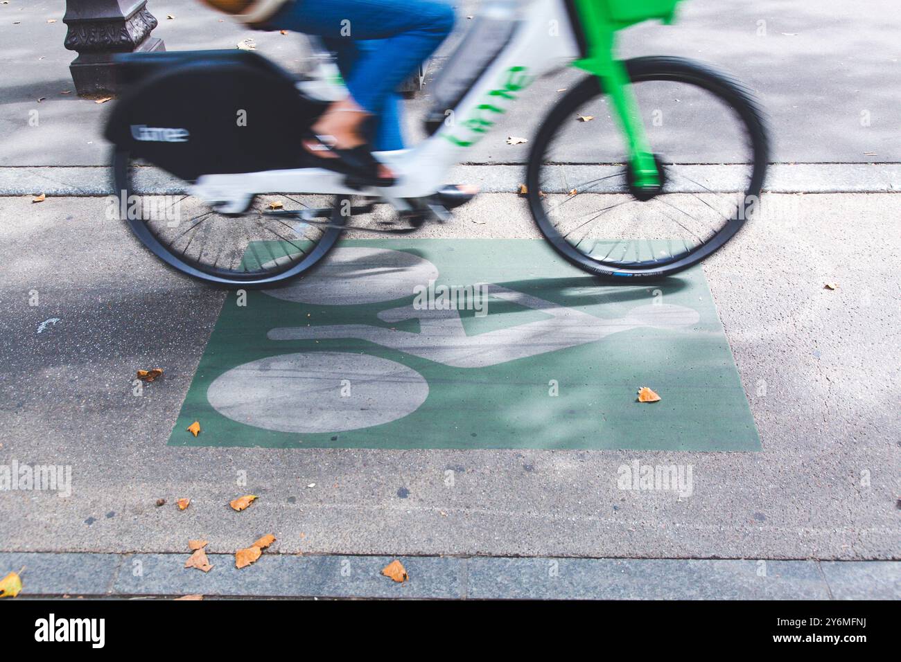France, Paris, Bike path in the city center. Cyclists on a cycle path ...