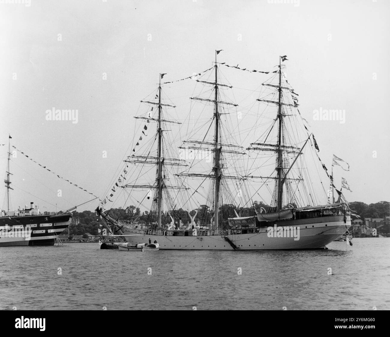 Tall ship moored next to HMS Worcester on the River Thames off ...
