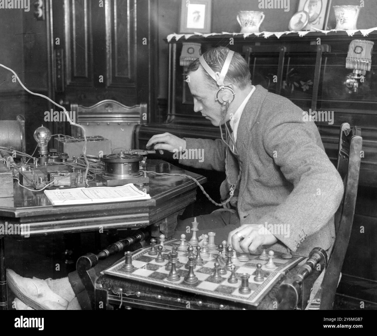 Mr. Frank Walsh, a young inventor, plays chess by wireless with his ...