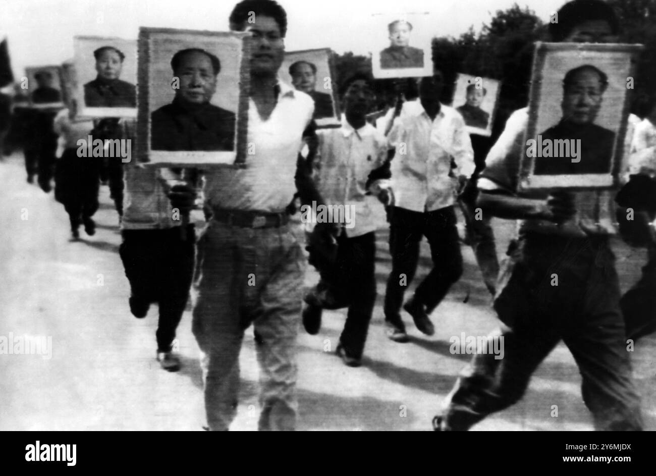 Peking, Red China: Holding portraits of Mao Tse-Tung, members of the ...