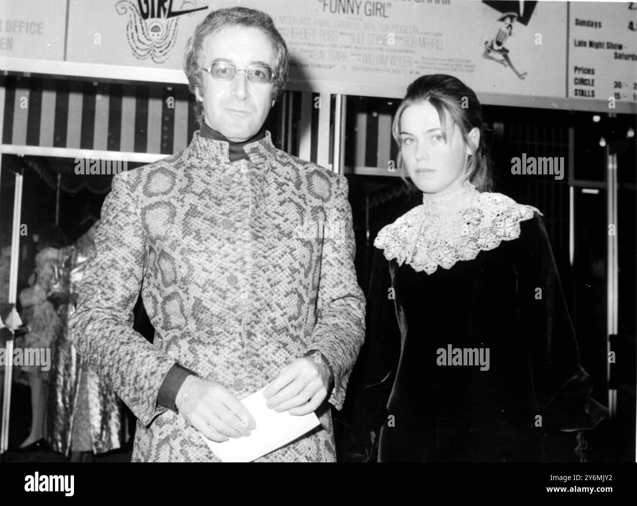 London actor Peter sellers, wearing a golden lame jacket, arrives at ...