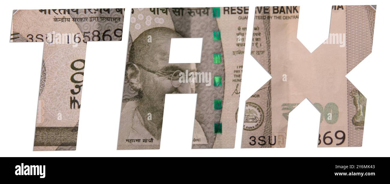 conceptual image of the word "TAX" formed with Indian Rupee banknotes ...
