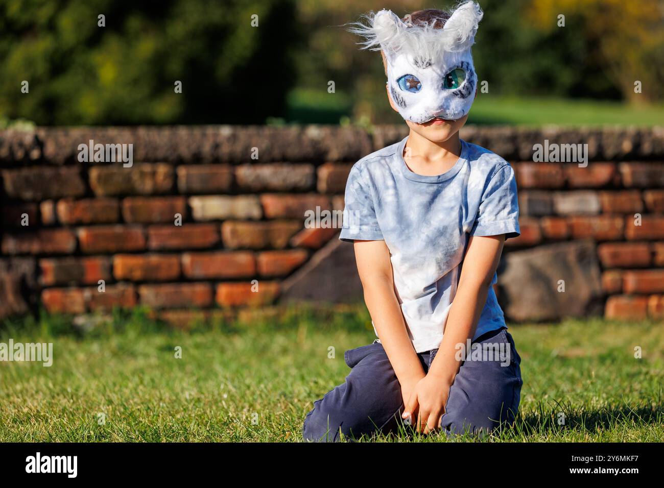 Cute young little kid girl wear cat furry mask enjoy have fun playing ...