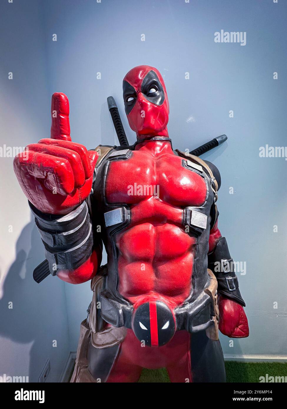 Statue with raised finger of Deadpool, the anti-hero Stock Photo - Alamy