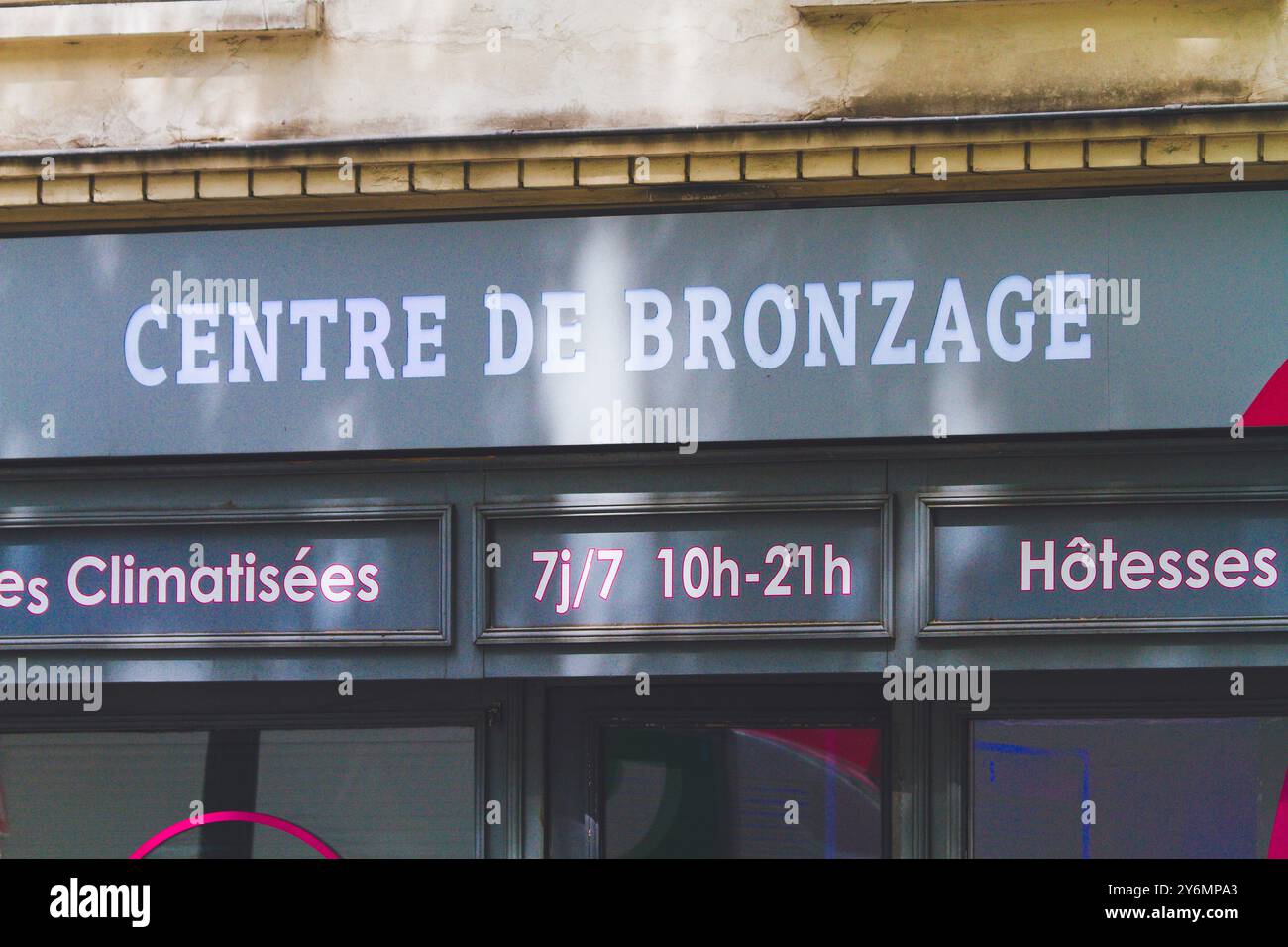 Tanning center sign, open seven days a week Stock Photo - Alamy