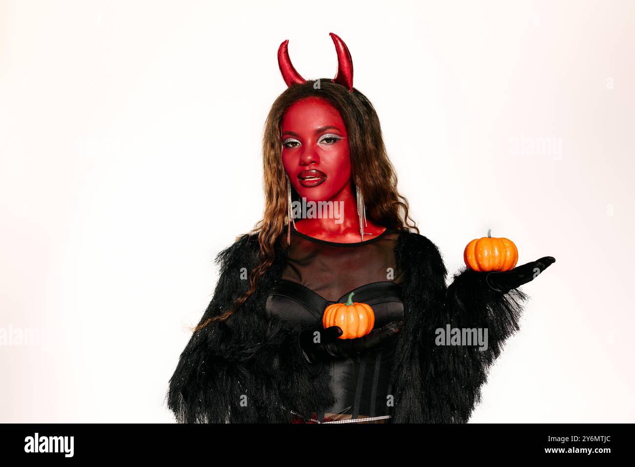 A stunning woman in a devil costume showcases her creativity with ...