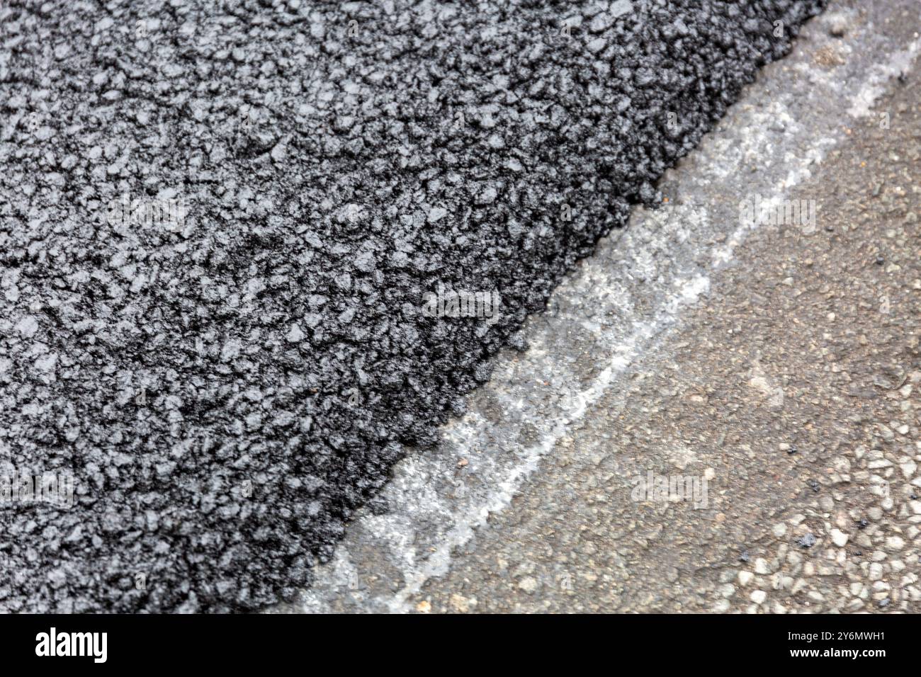 Construction of a bitumen coating on a highway Stock Photo - Alamy