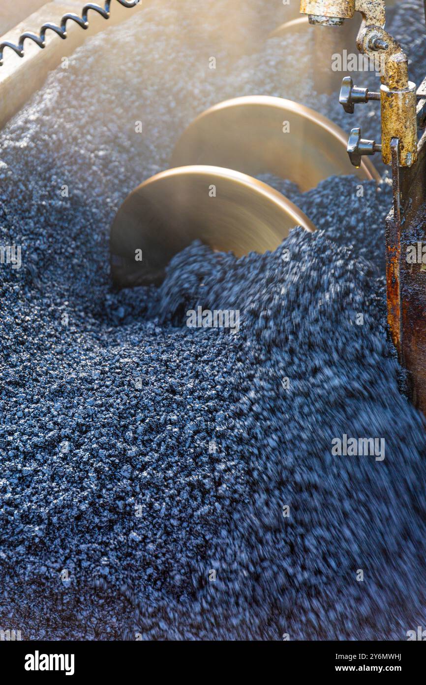 Construction of a bitumen coating on a highway Stock Photo - Alamy