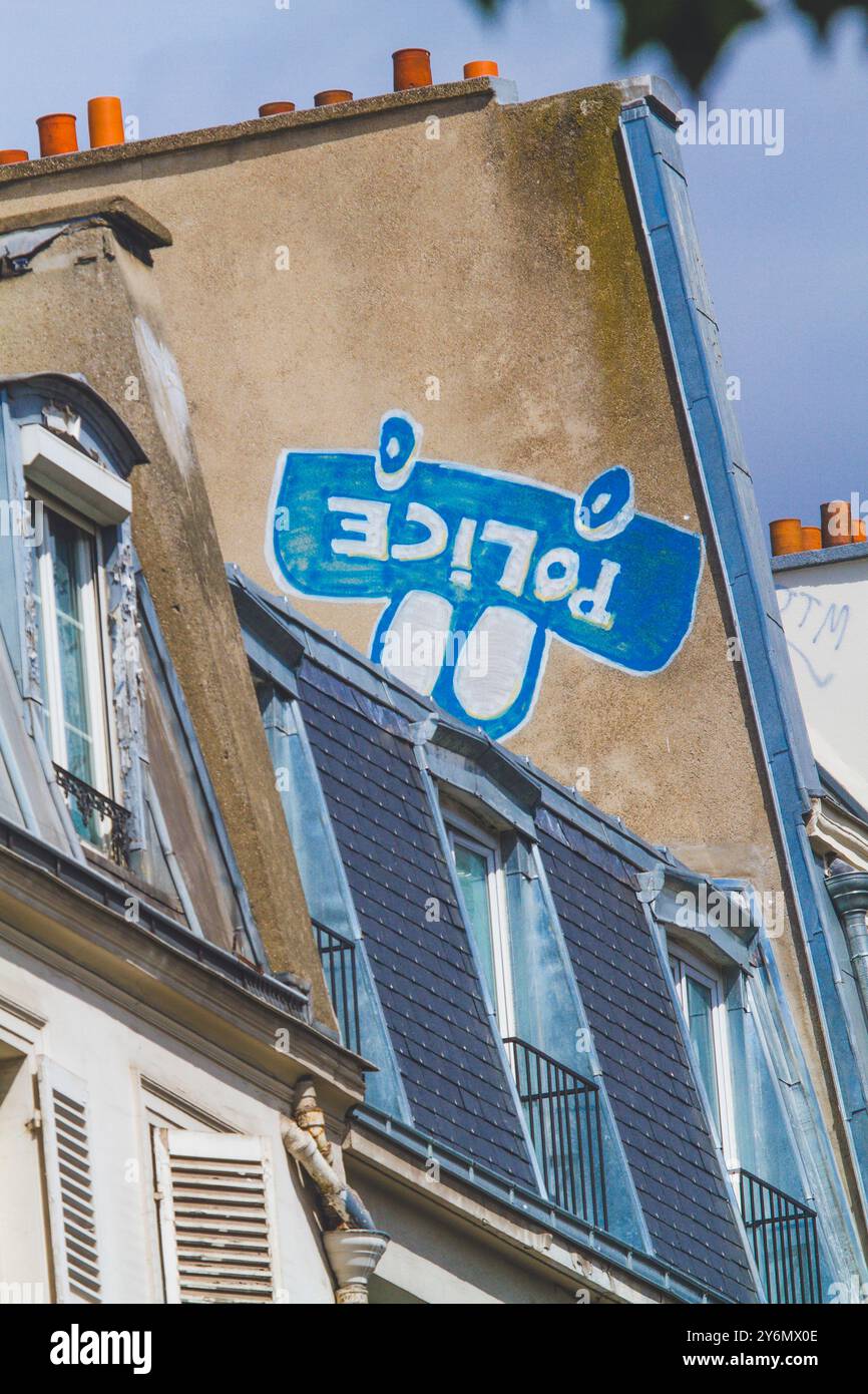 ile-de-France, Paris, Street Art downtown, the police car upside down ...