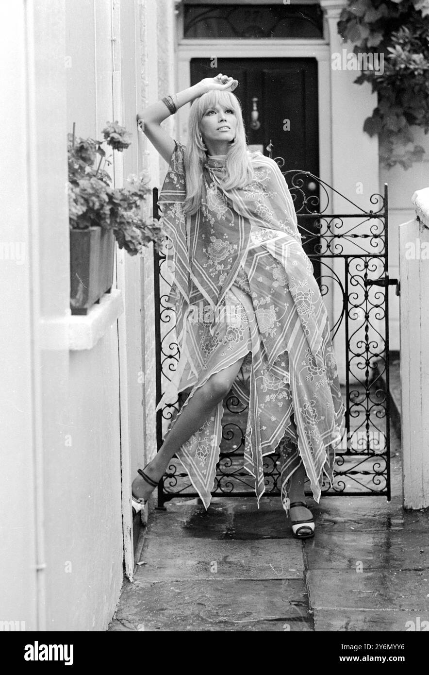 London: well wrapped ... in many scarves ... is this young lady ...