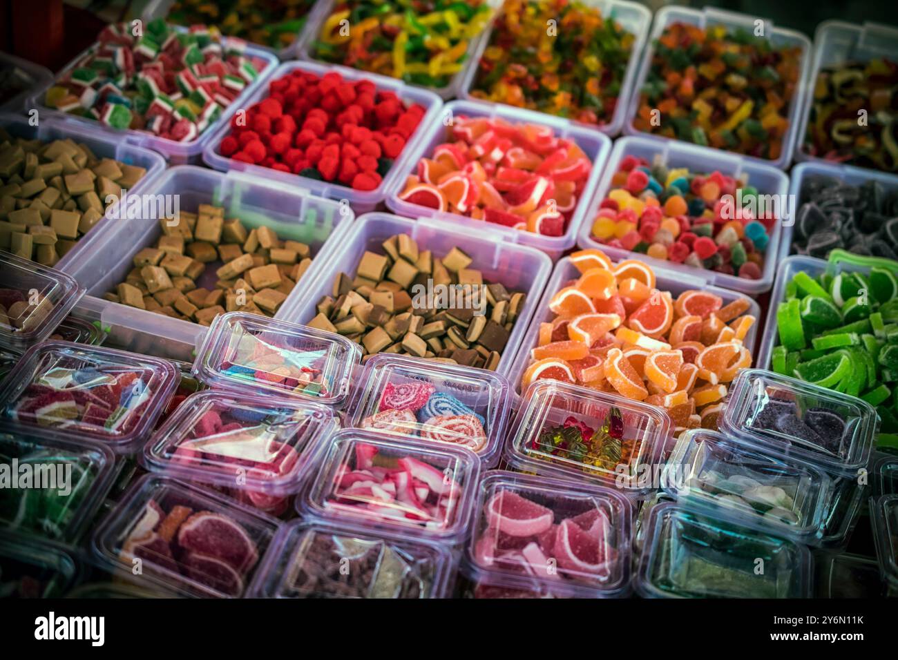 Assortment of colorful handmade candies in boxes on a stall Stock Photo ...