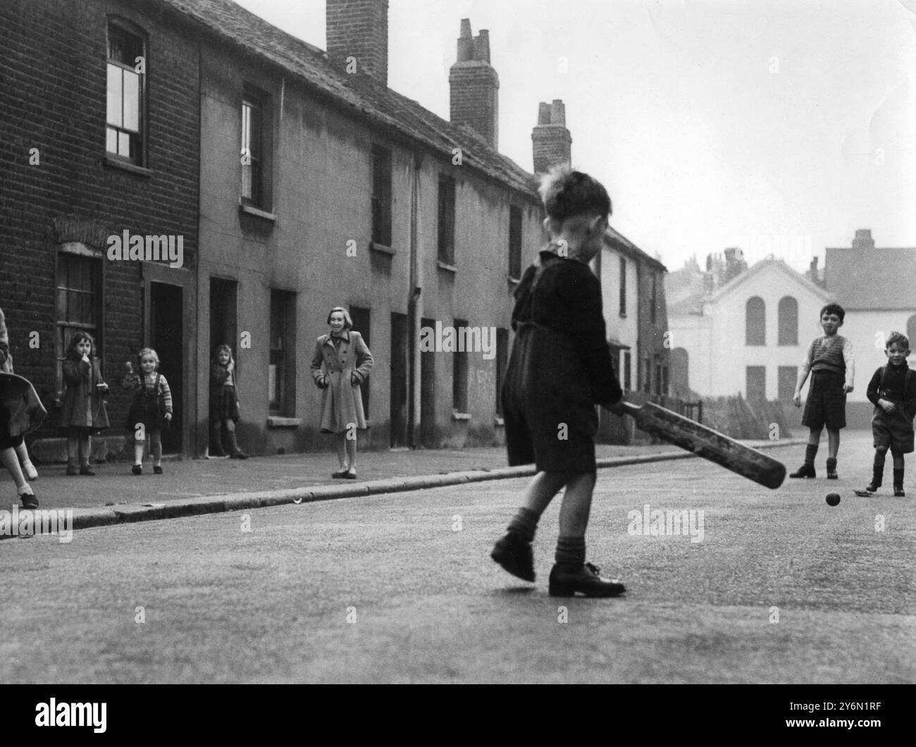 Children playing cricket in the street Stock Photo - Alamy