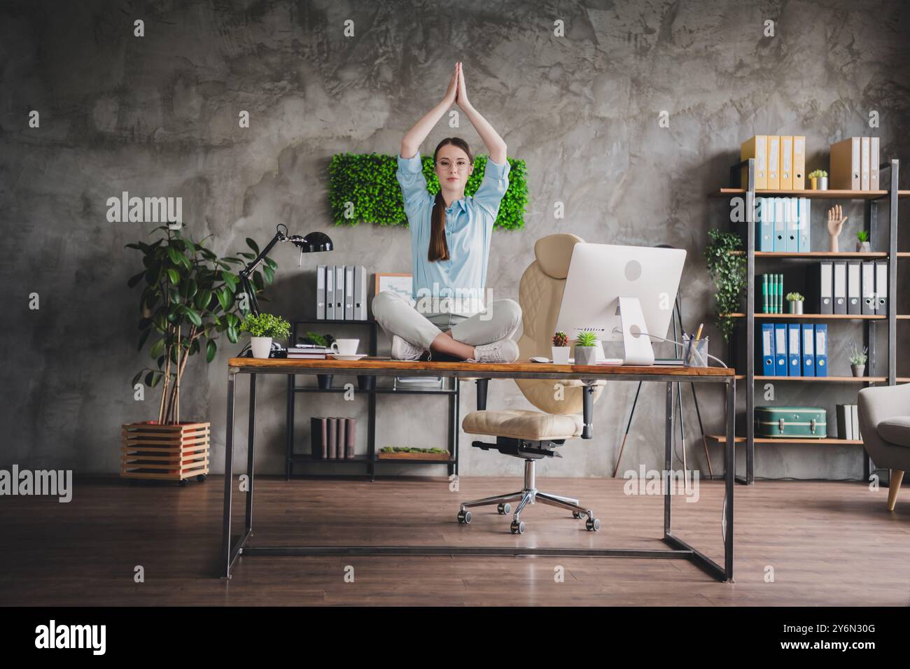 Photo of sweet charming lady assistant wear shirt glasses sitting table ...