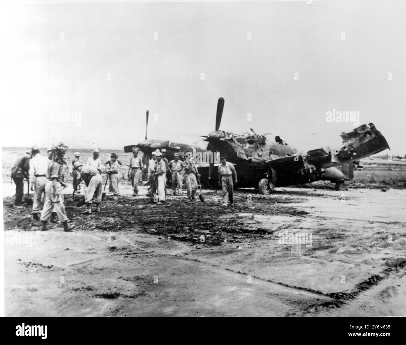South Korean soldier repair bomb damage on the Suwon airfield which was ...