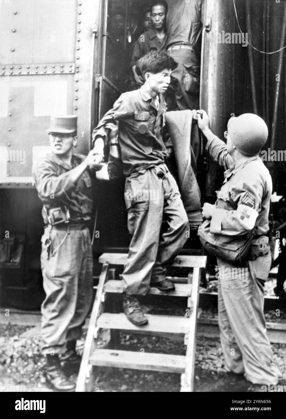 Korea: A Communist prisoner is assisted from the train at a UN Prison ...