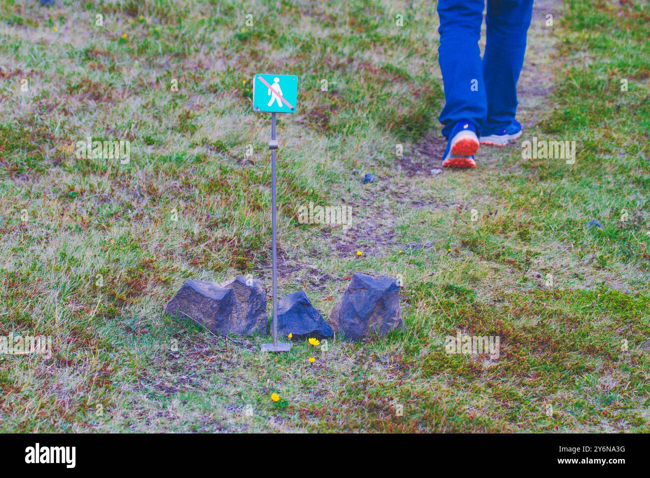 Iceland, small closed path with a few stones and a small prohibition ...