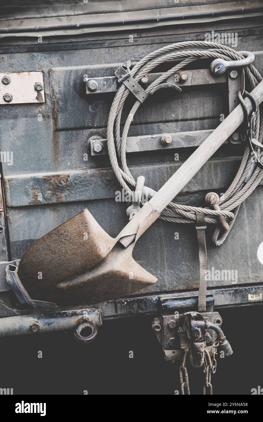 Rear of a vehicle equipped with rescue equipment. Shovel, cable ...