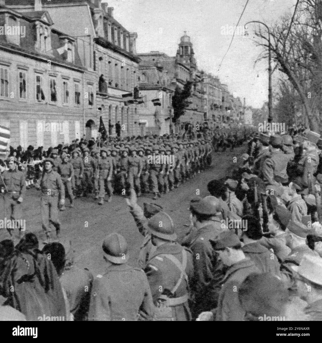 Troops of the American 28th Division marching past the saluting-base in ...