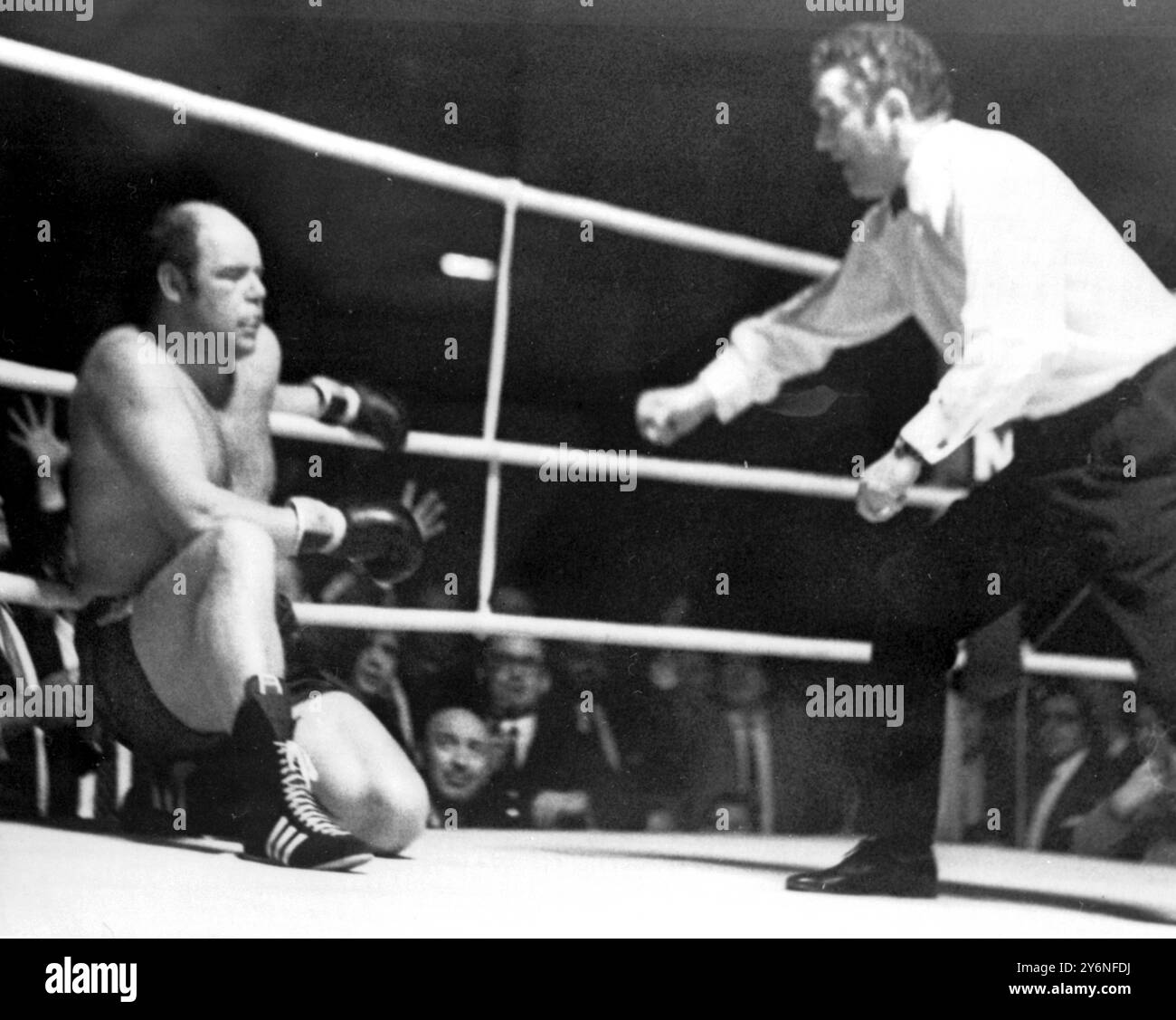 Madrid: West Germany's Peter Weiland down on the ropes after being ...