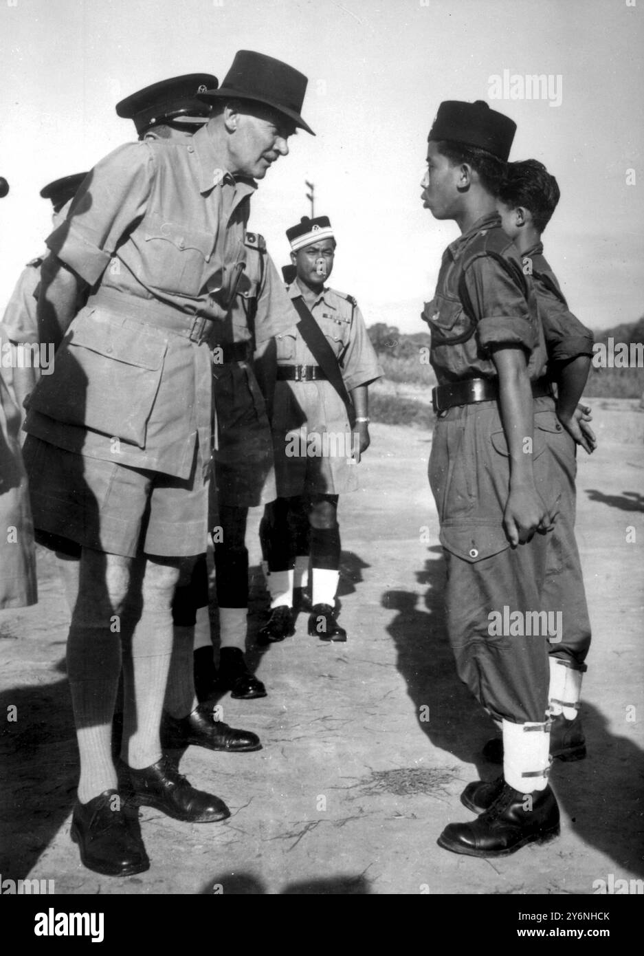Sungei Bulch, North Selangor: Wearing a trilby hat to protect his head ...