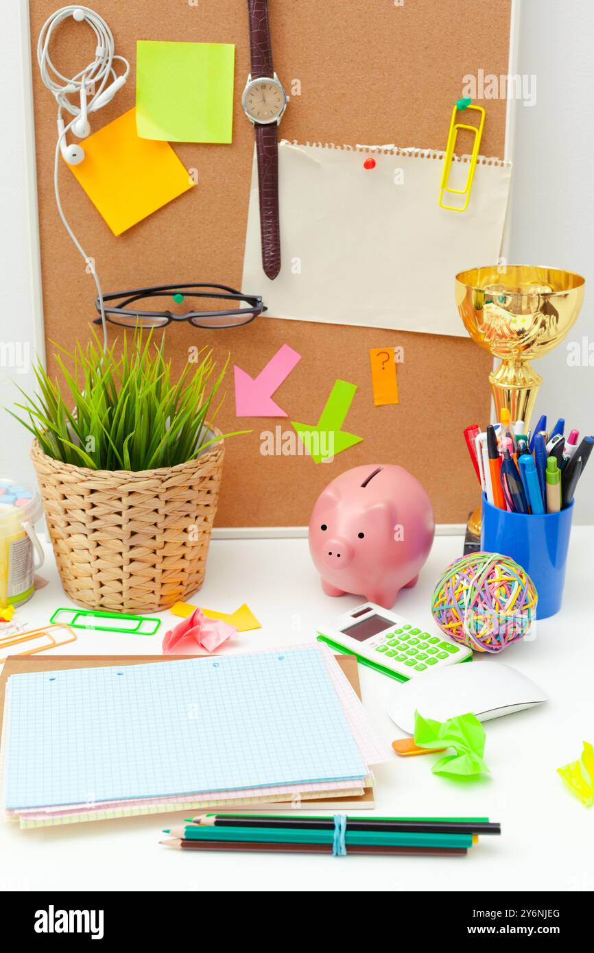 Work place of a creative person with a variety of colorful stationery ...