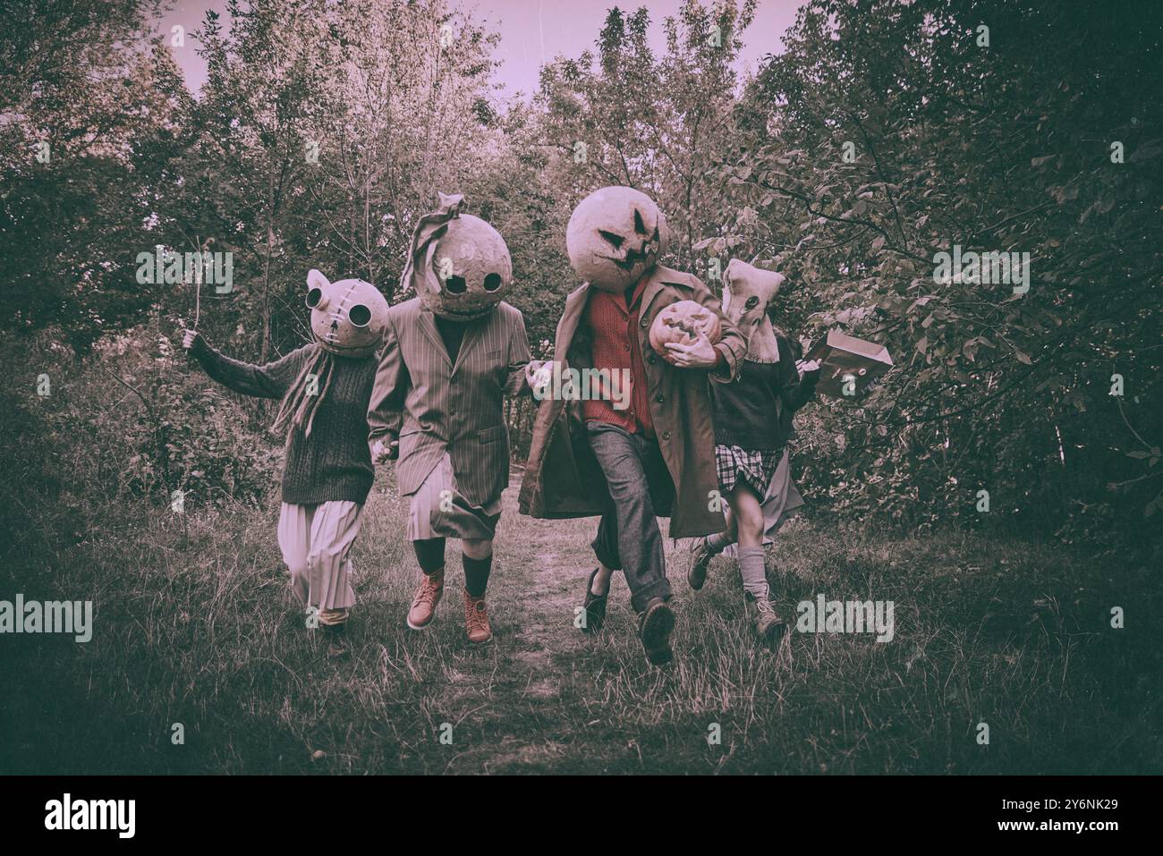 Group of creepy figures in terrifying masks hiding their personality ...