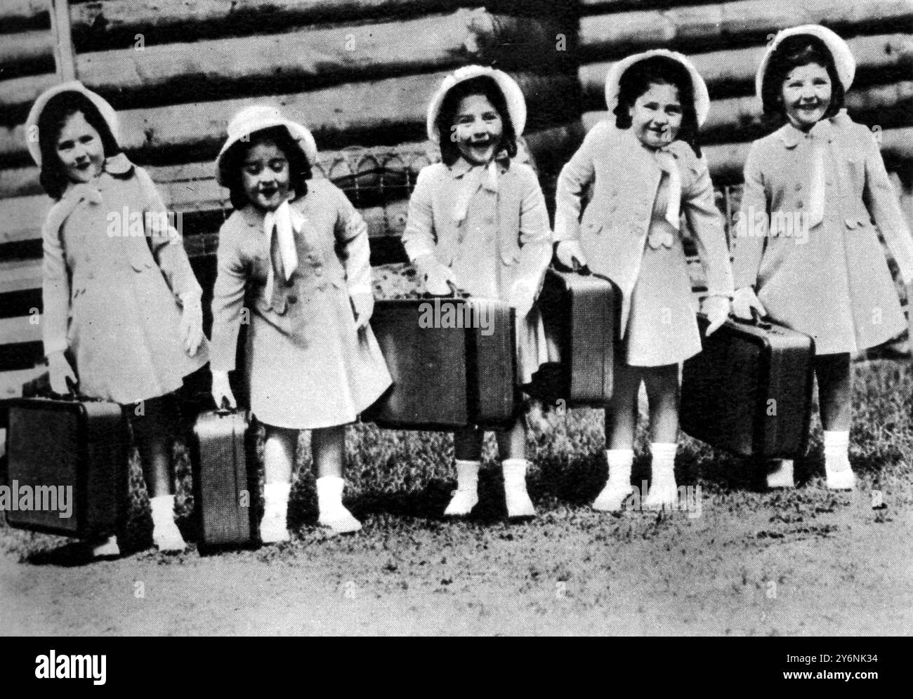 The Dionne quins iready to set out on their first railway journey, here ...