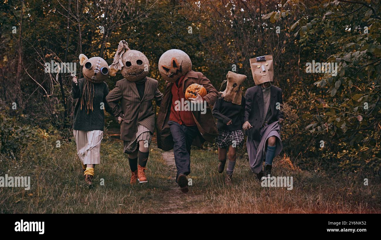 Group of creepy figures in terrifying masks hiding their personality ...