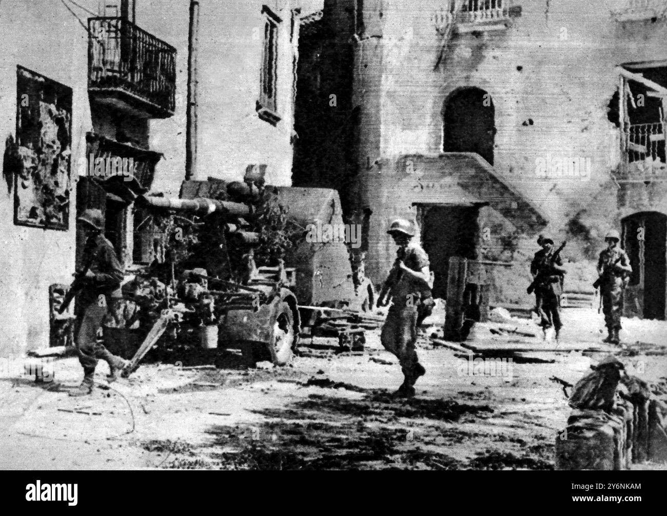 The onward push from Salerno, US troops entering a wrecked square in ...