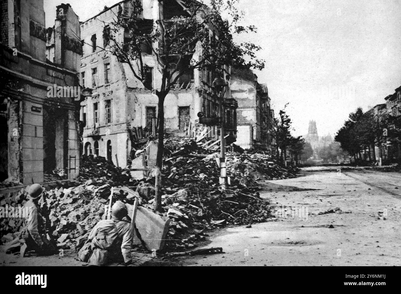 An American machine gun post set up behind the debris of a wrecked ...