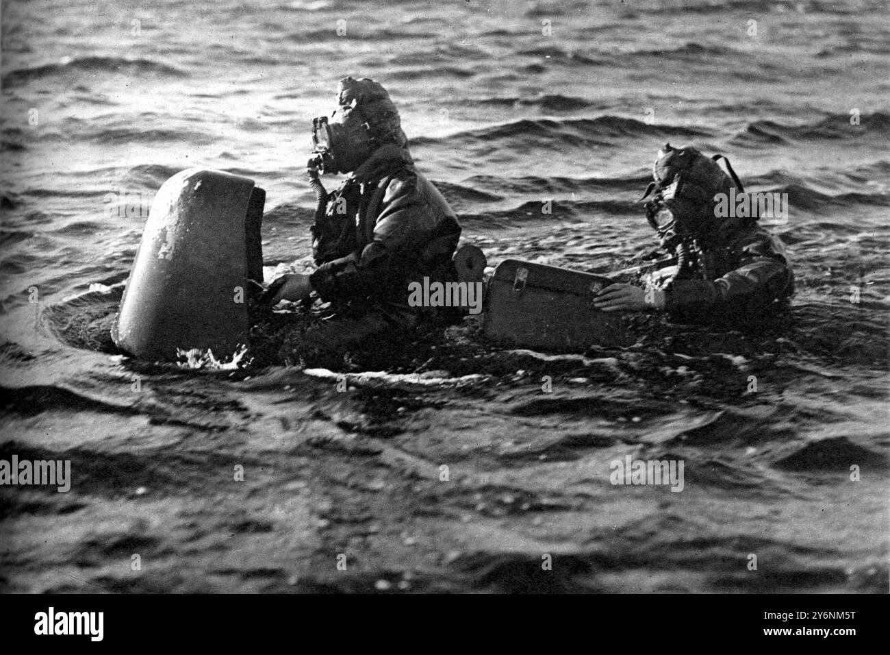 A human torpedo under way with its crew of two men riding astride. The ...