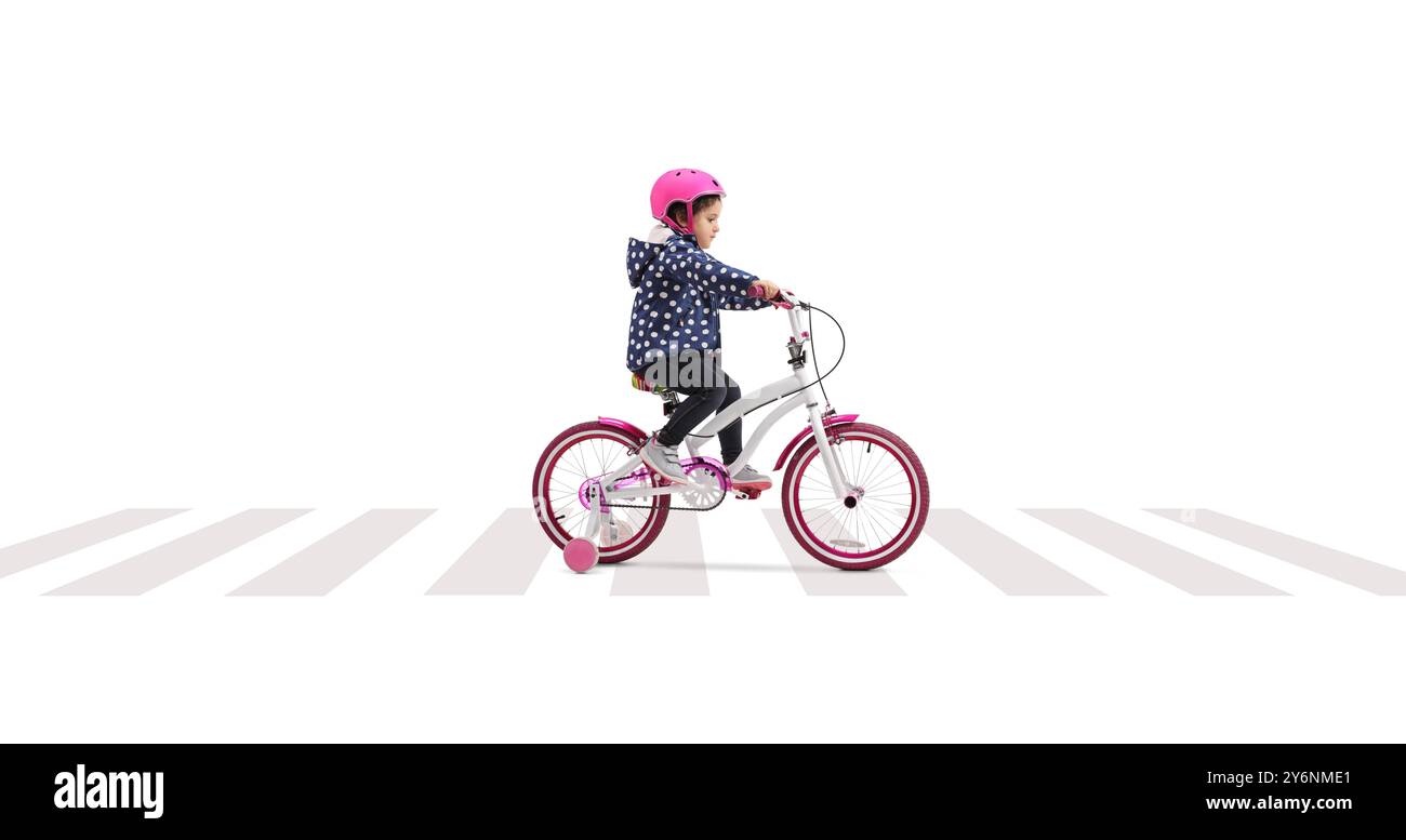 Little girl riding a bike at pedestrian zebra crossing isolated on ...