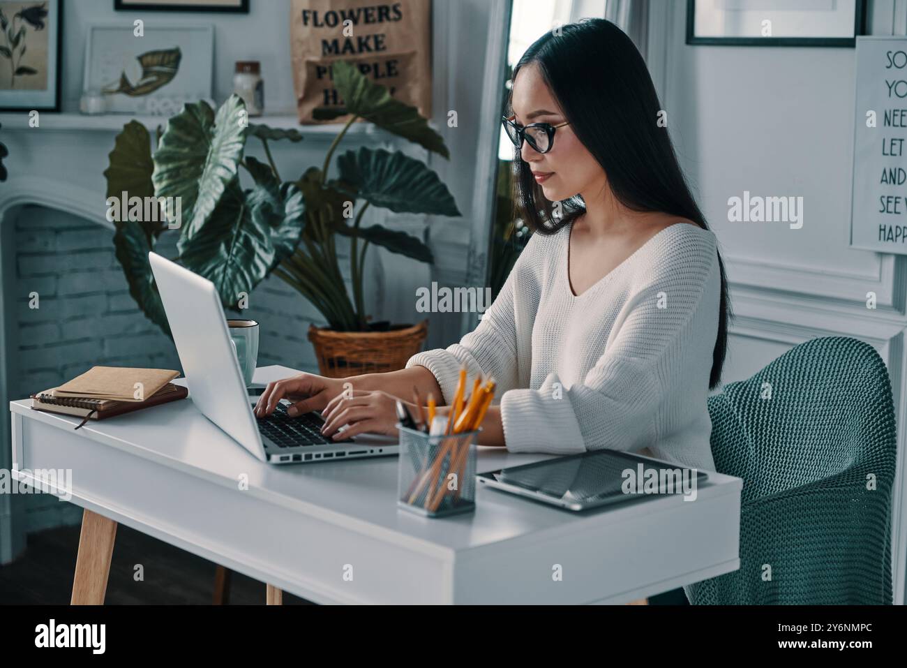 New decisions every day. Beautiful young woman working using computer ...