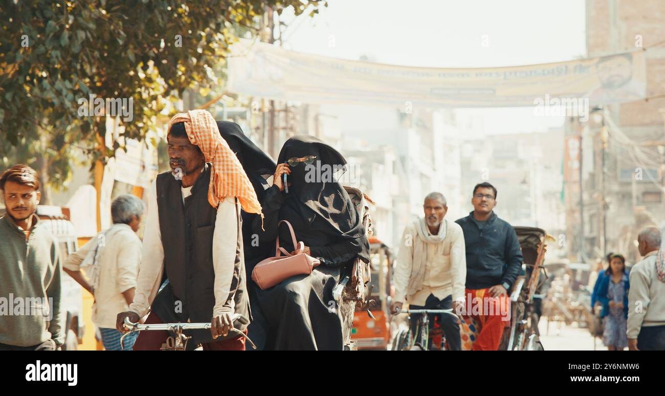 Varanasi, India. People Walk Along Busy Street. Two Muslim Women In ...