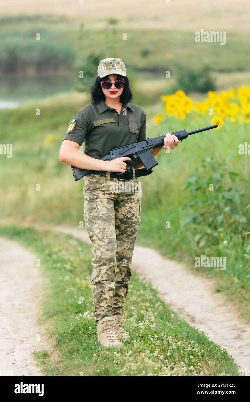 Soldier woman in military uniform. A girl in a military uniform with a ...