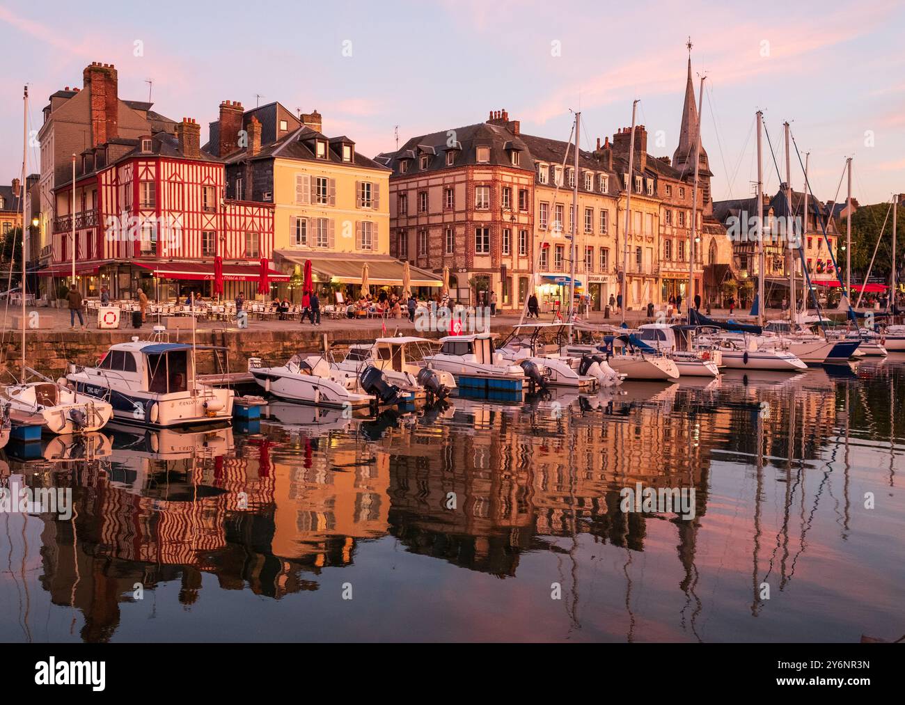 Beautiful old buildings line the harbour at the colourful, picturesque ...