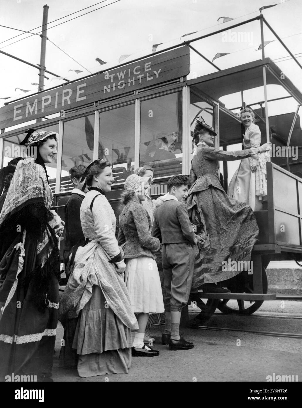 Passengers in period costume board a Victorian coach during the 150th ...