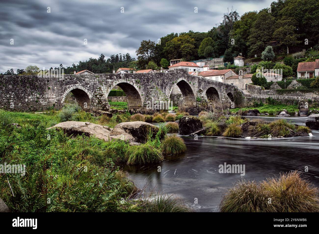 An medieval bridge over a river in Galicia. Pontemaceira Stock Photo ...