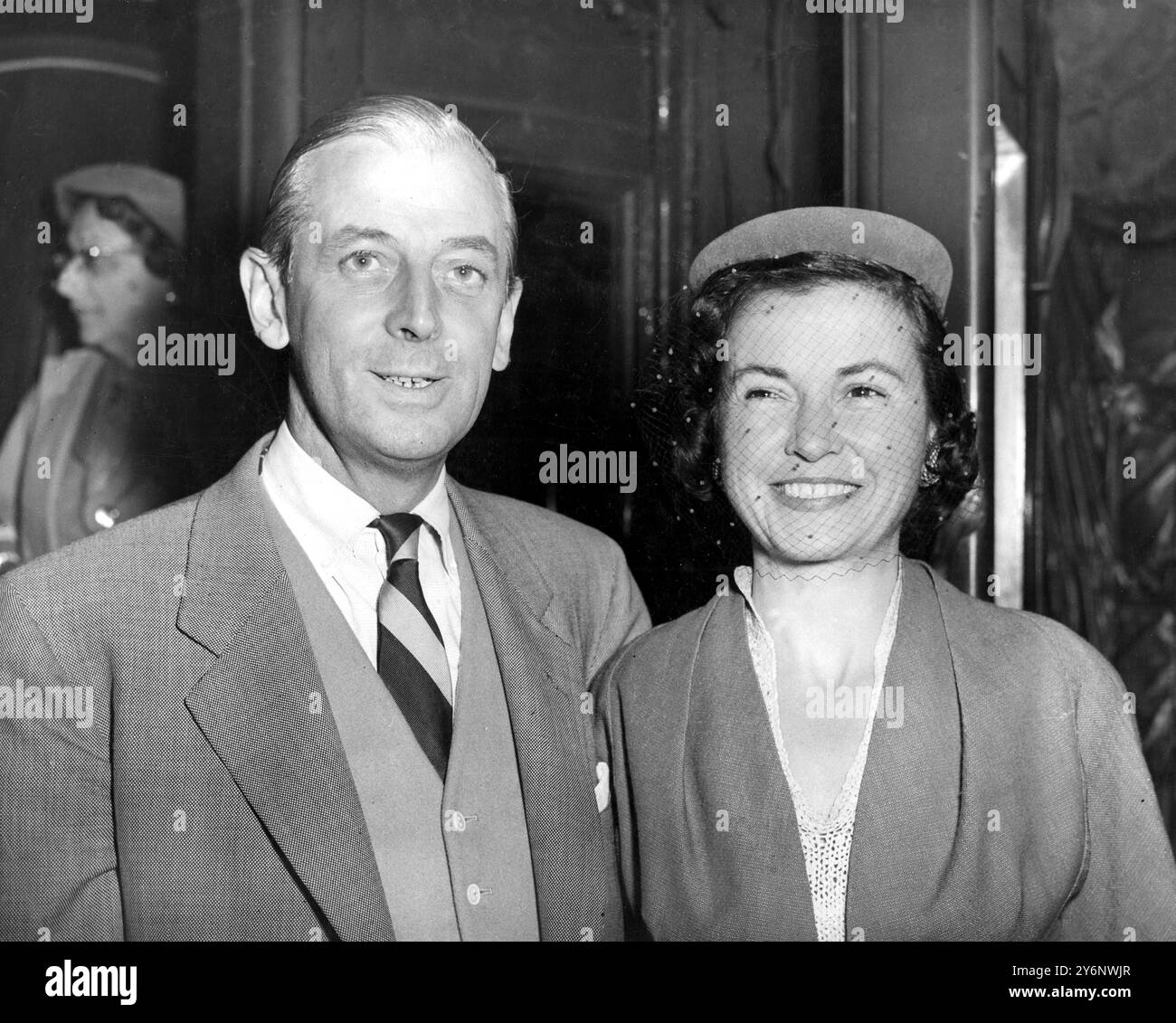 Alistair Cooke and his wife leave Waterloo Station on the Queen Mary ...