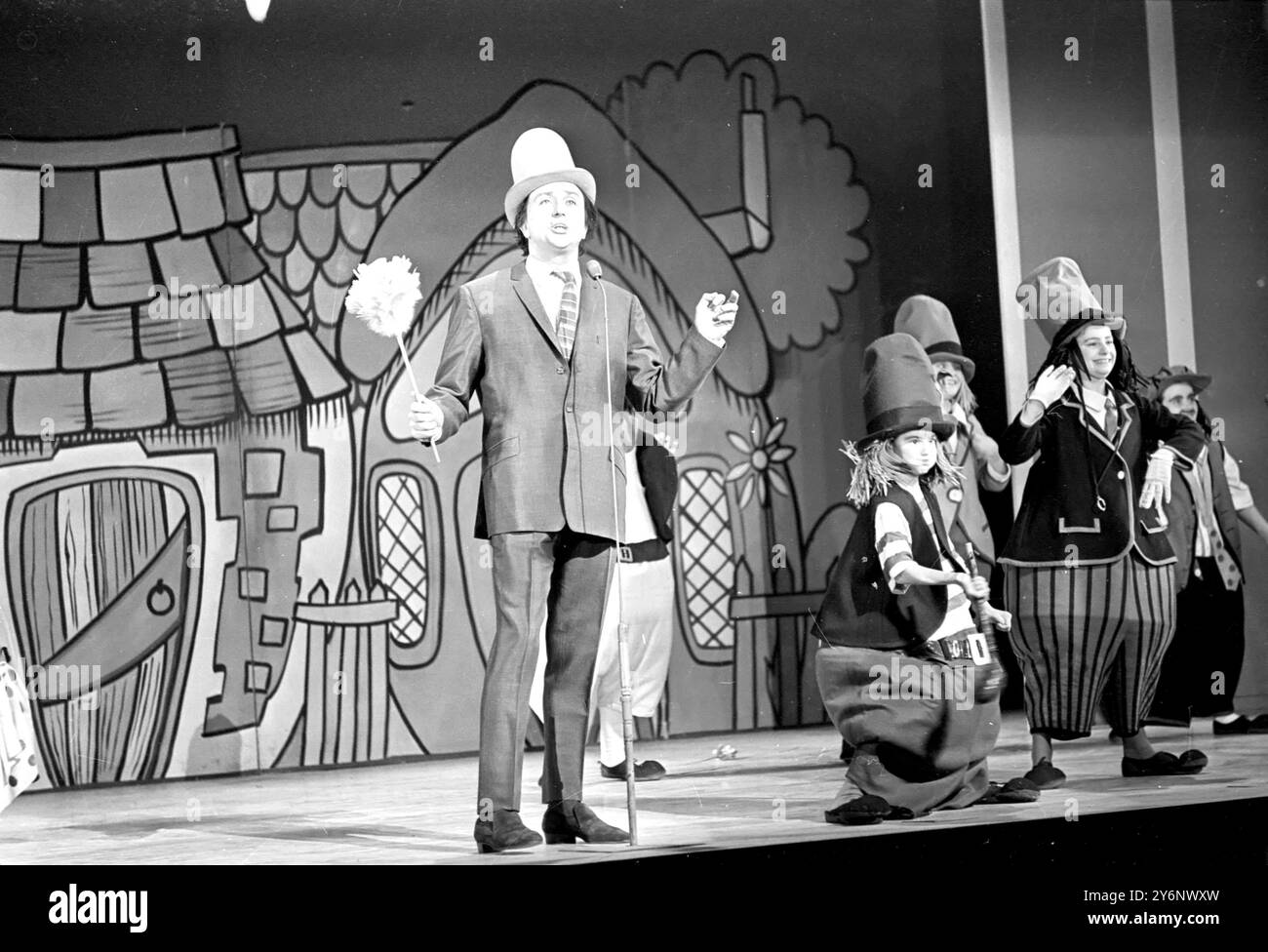 London: Comedian Ken Dodd and young school children playing part of ...