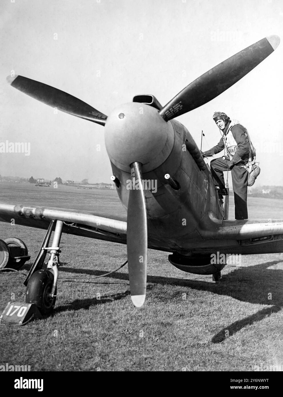 A pilot of the Army Co-operation Command, of the RAF climbing into his ...