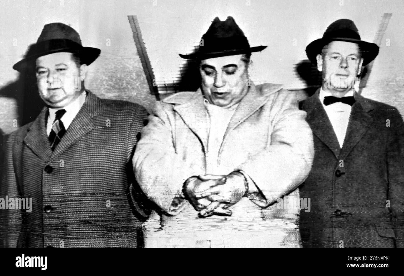 Boston: Anthony Pino (centre), 48, one of the men arrested for the six ...