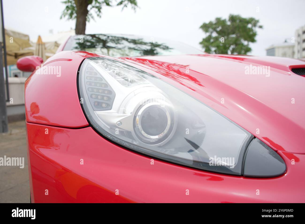 Red luxury car, light close up Stock Photo - Alamy