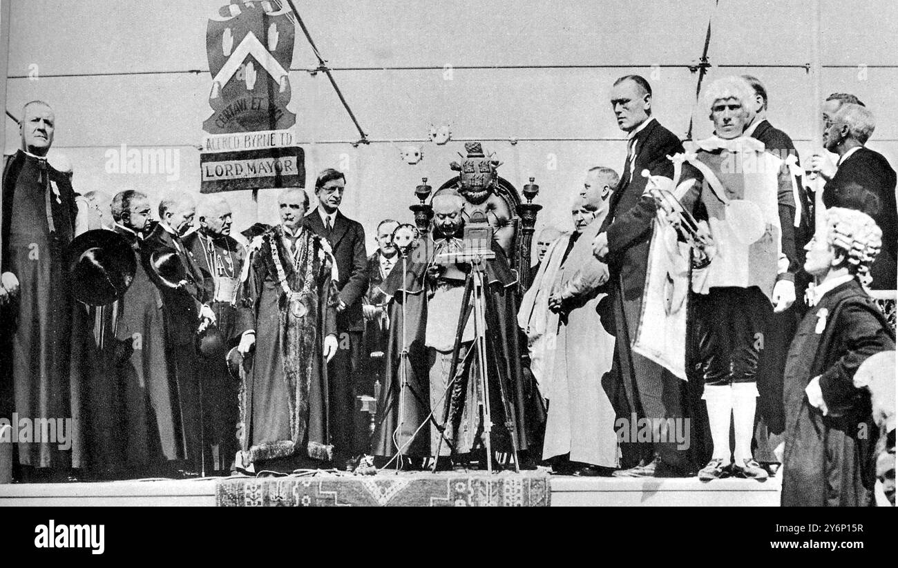 Cardinal Lauri,The Papal Legate (speaking into a micophone), replying ...