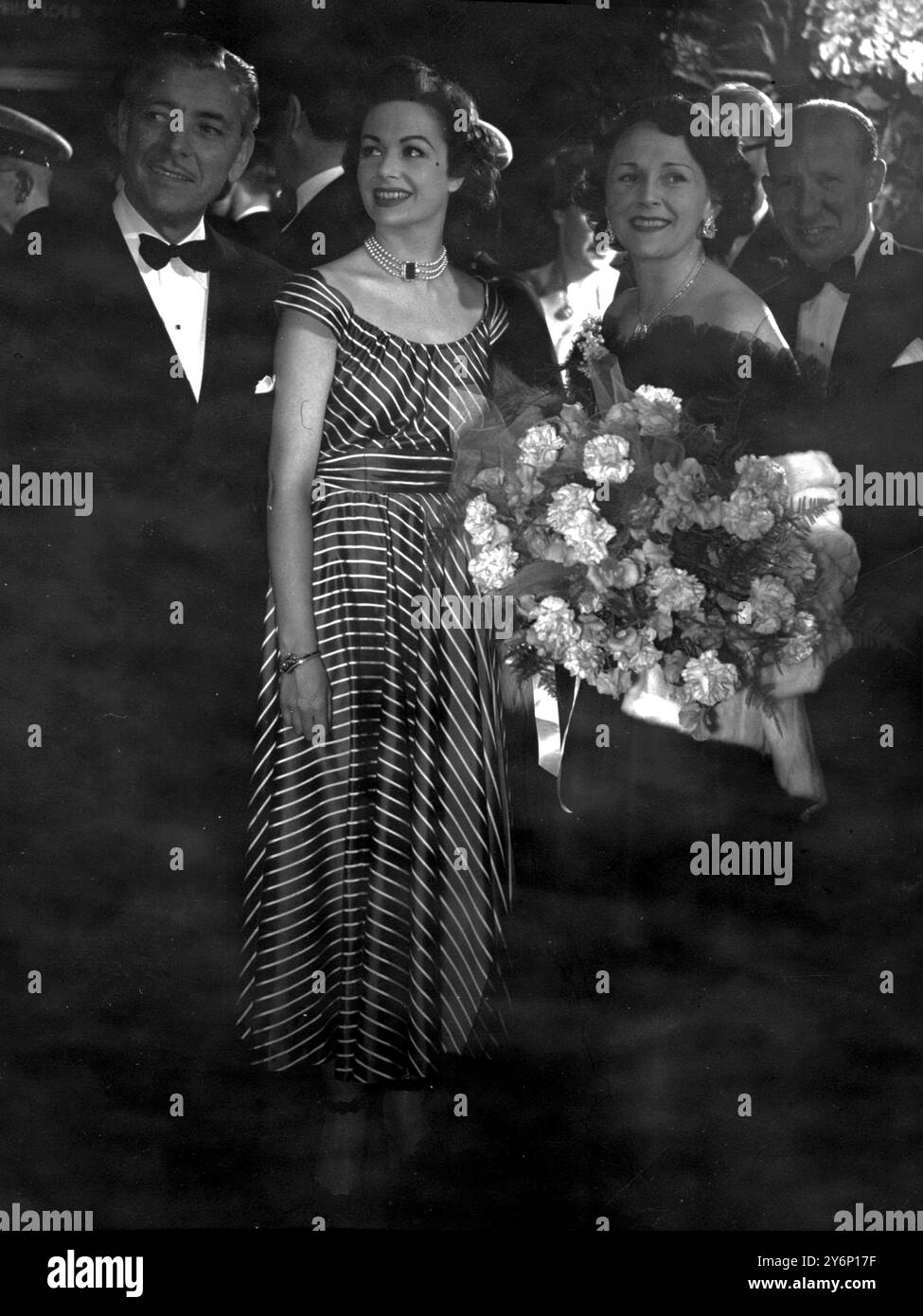 In striking ballet length gown screen star Margaret Lockwood mets Ronald Colman and his wife ...