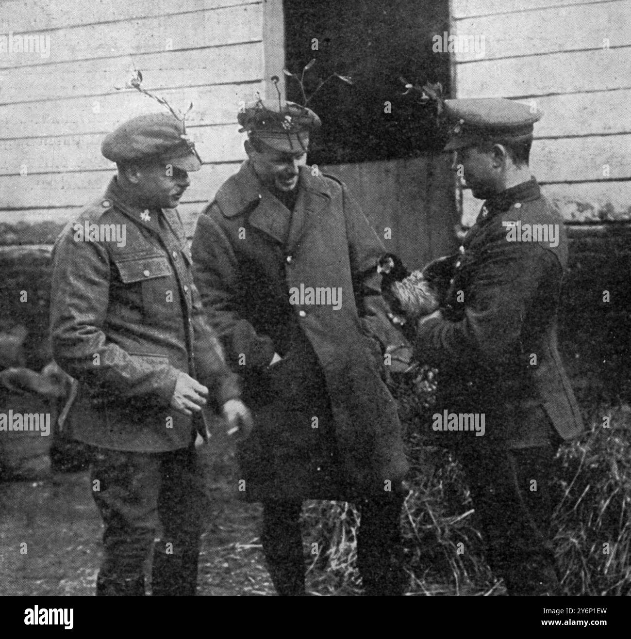 Carry his Christmas dinner a soldier showing comrades a chicken he has ...